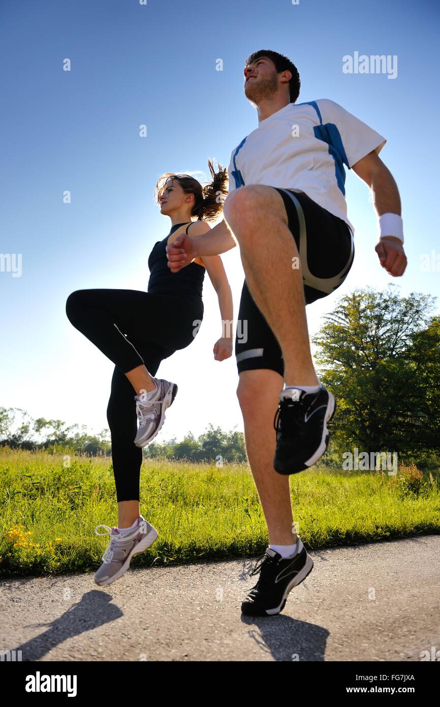 Young couple jogging Stock Photo - Alamy