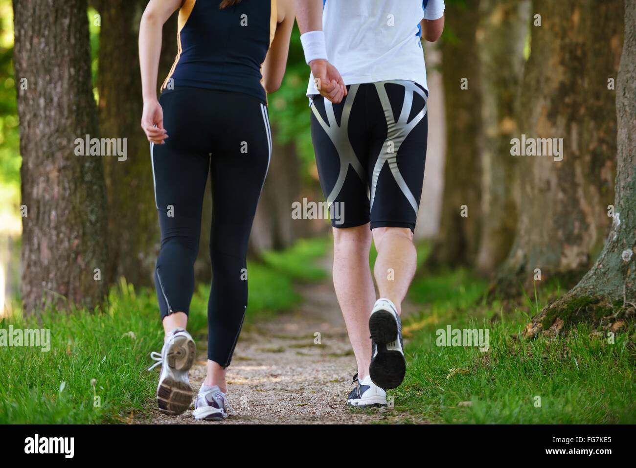 Young couple jogging Stock Photo - Alamy