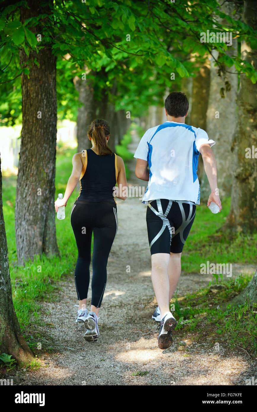 Young couple jogging Stock Photo - Alamy