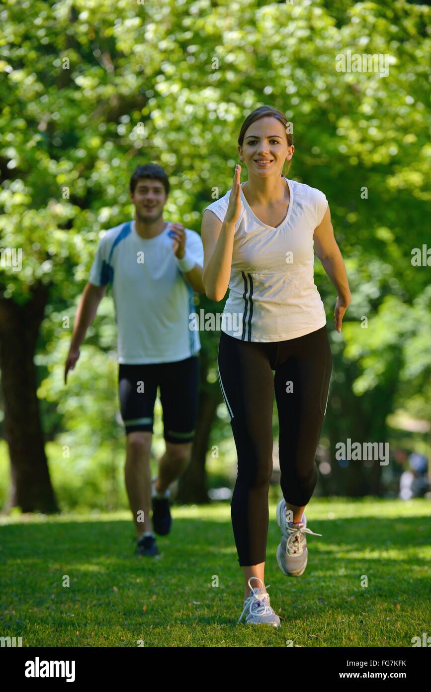 Young couple jogging Stock Photo - Alamy