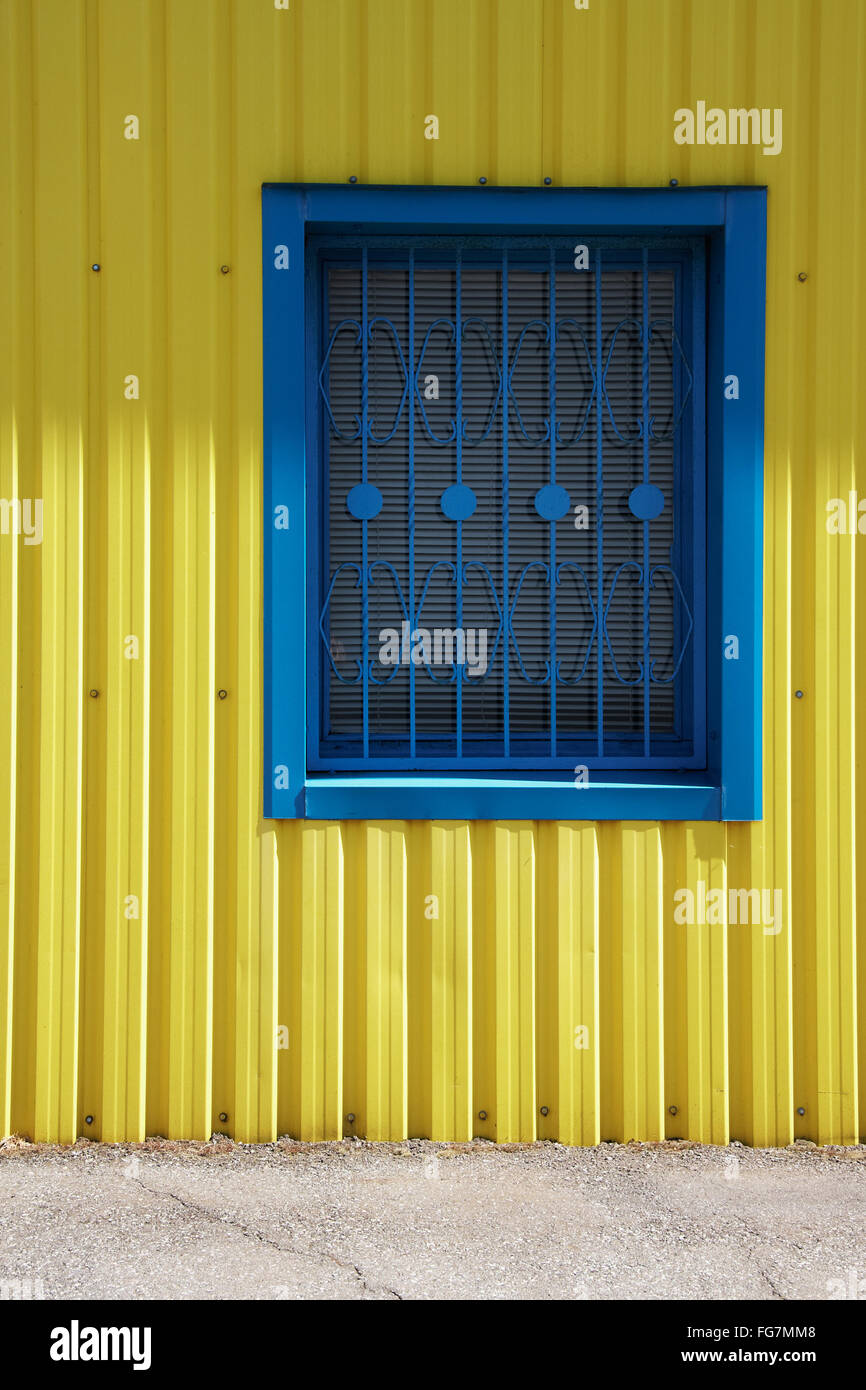 yellow with Blue window Stock Photo - Alamy