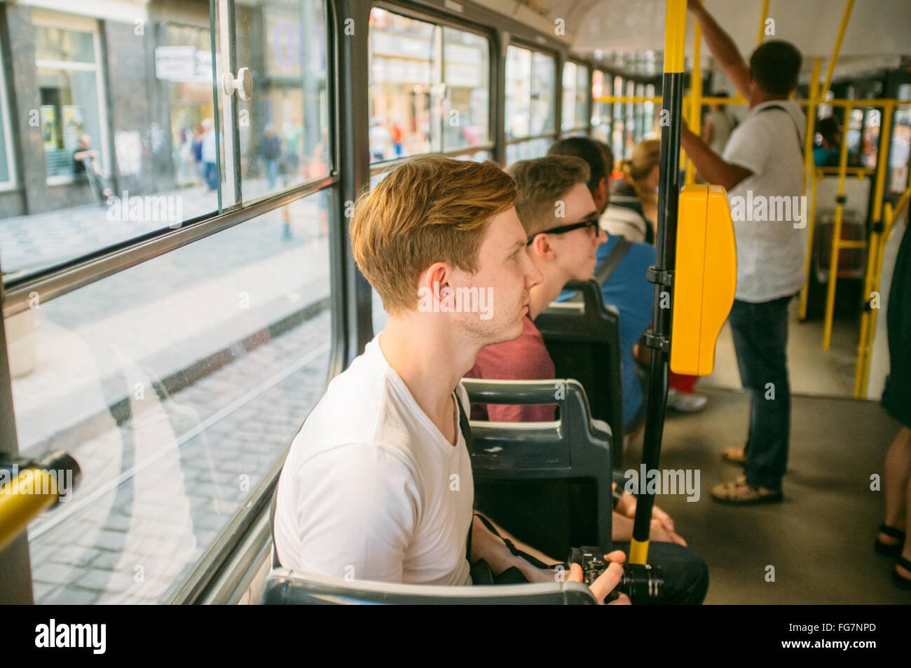 Young man sitting on bus hi-res stock photography and images - Alamy