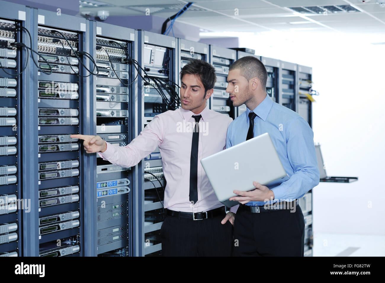 it enineers in network server room Stock Photo - Alamy