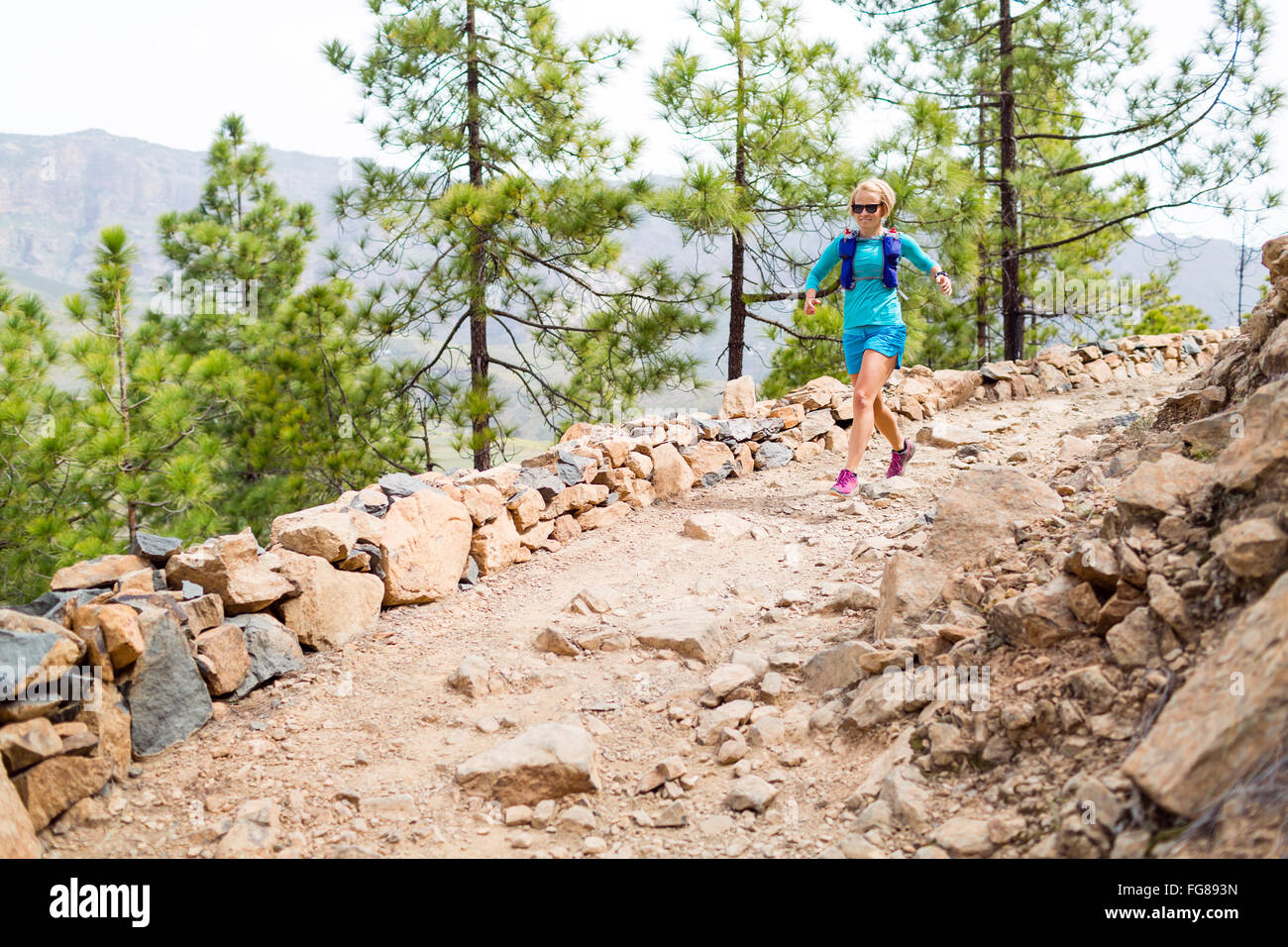 Trail runner woman cross country running in mountains, inspirational ...