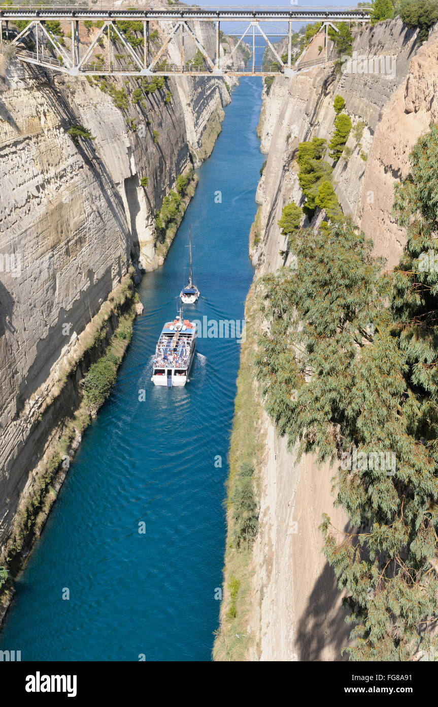A tourist boat and yacht cruise through the Corinth Canal, Greece Stock ...