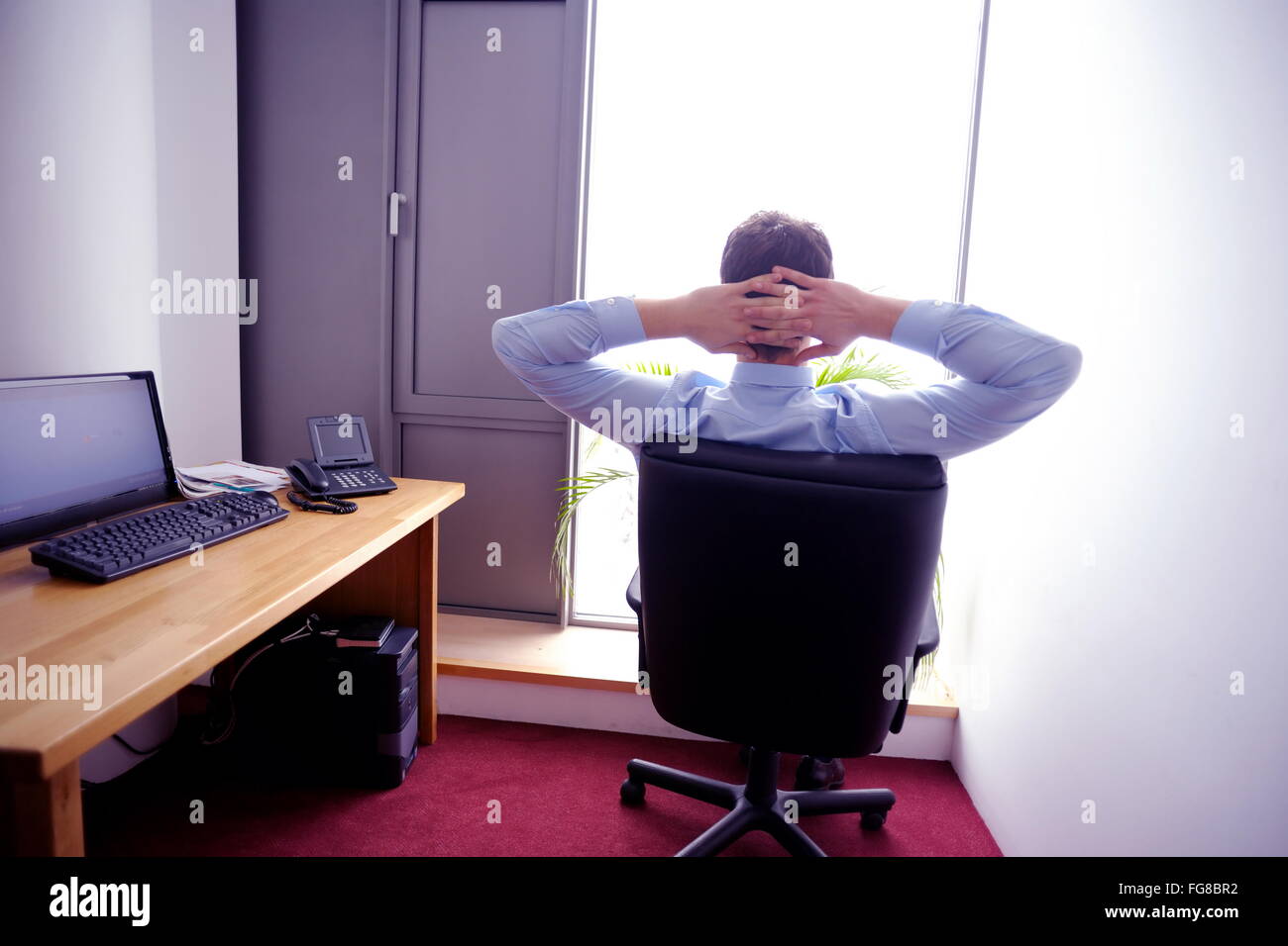happy young business man at office Stock Photo - Alamy