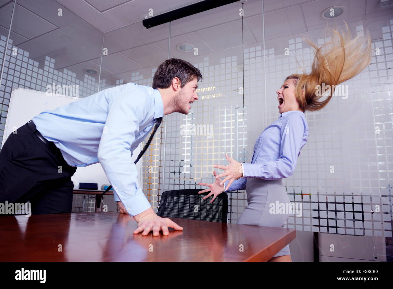 Angry busines sman screaming at employee Stock Photo - Alamy