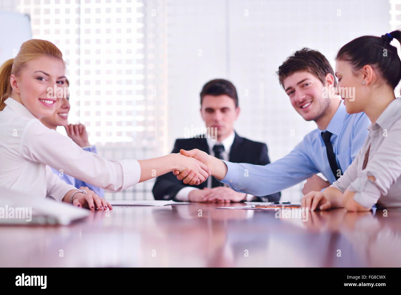 business people making a deal at meeting Stock Photo - Alamy