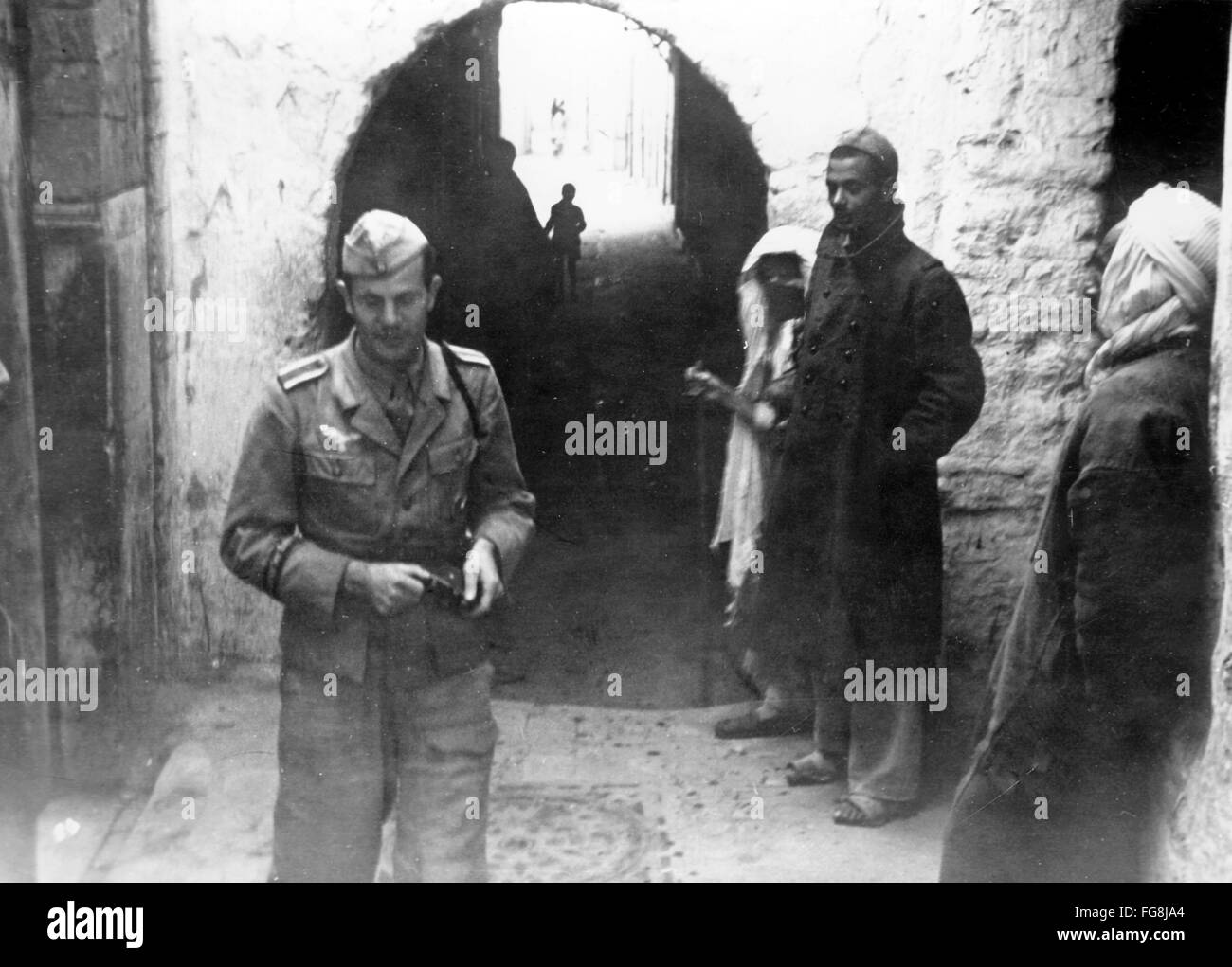 The Nazi propaganda picture shows a German soldier holding a photo ...