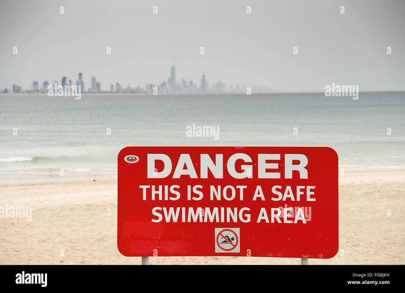 Warning Sign At Beach Against Sky Stock Photo - Alamy