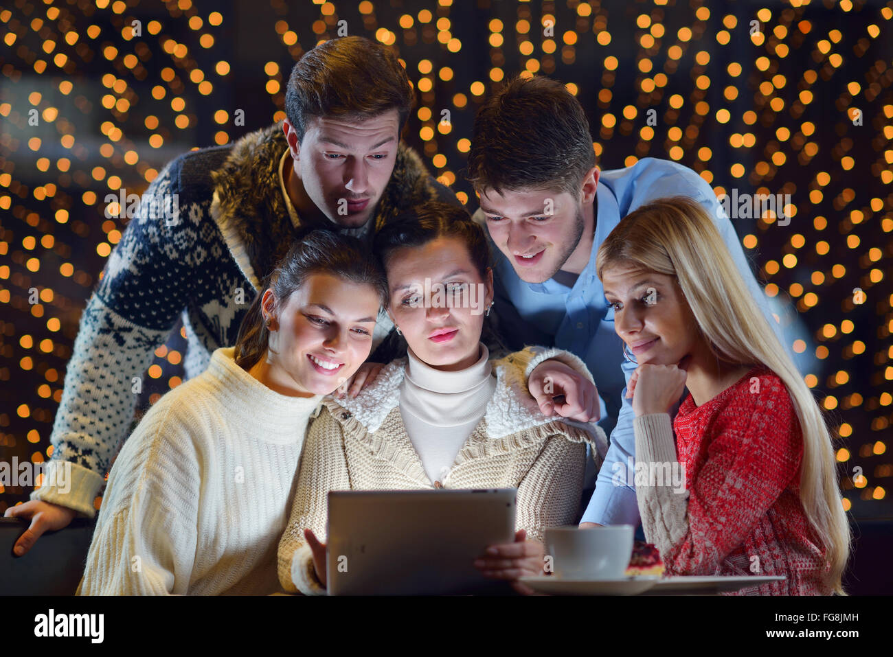 happy people looking at a tablet computer Stock Photo - Alamy