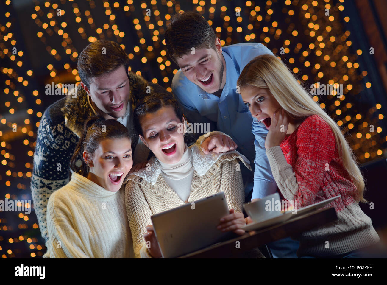 happy people looking at a tablet computer Stock Photo - Alamy