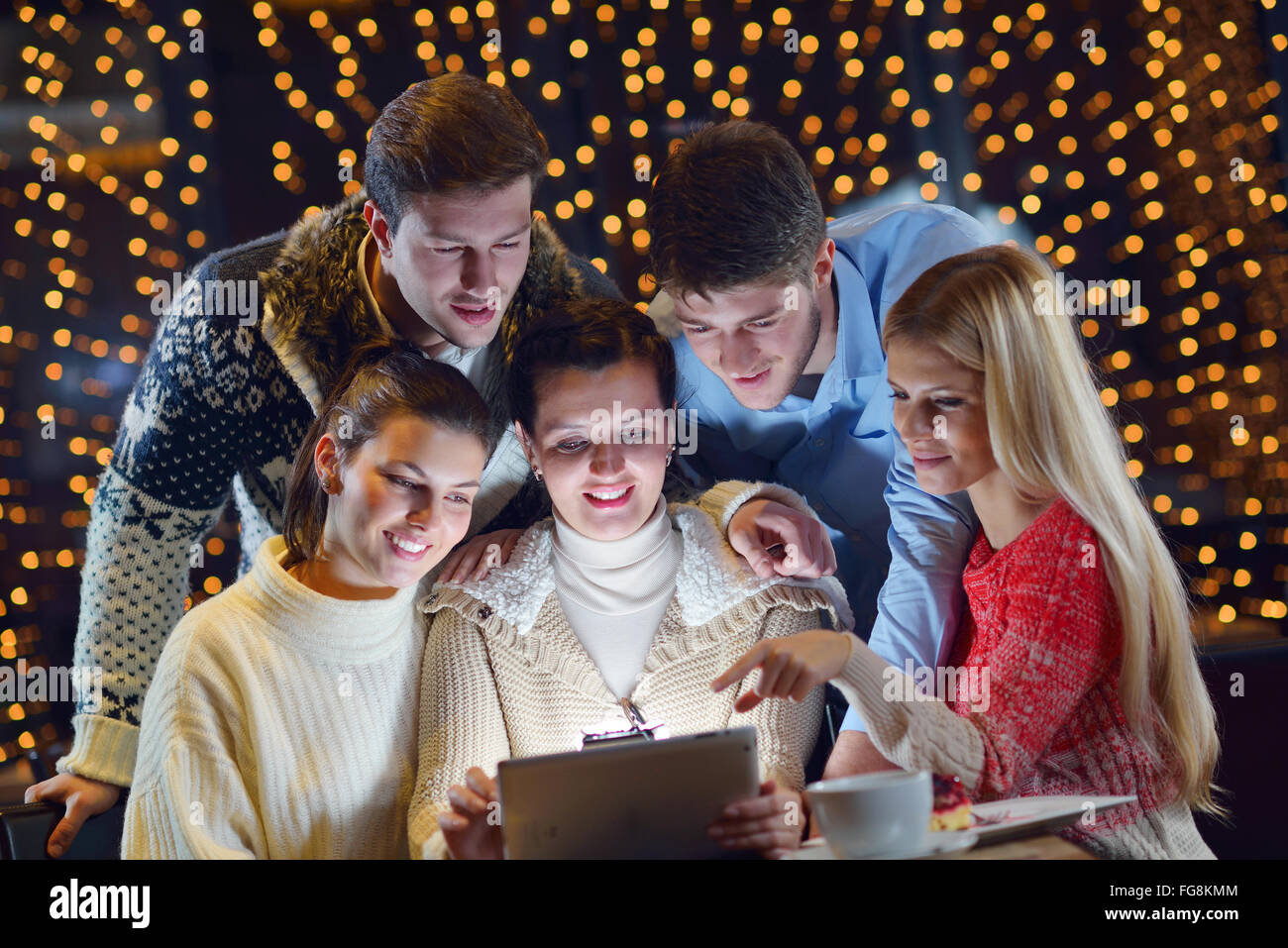 happy people looking at a tablet computer Stock Photo - Alamy