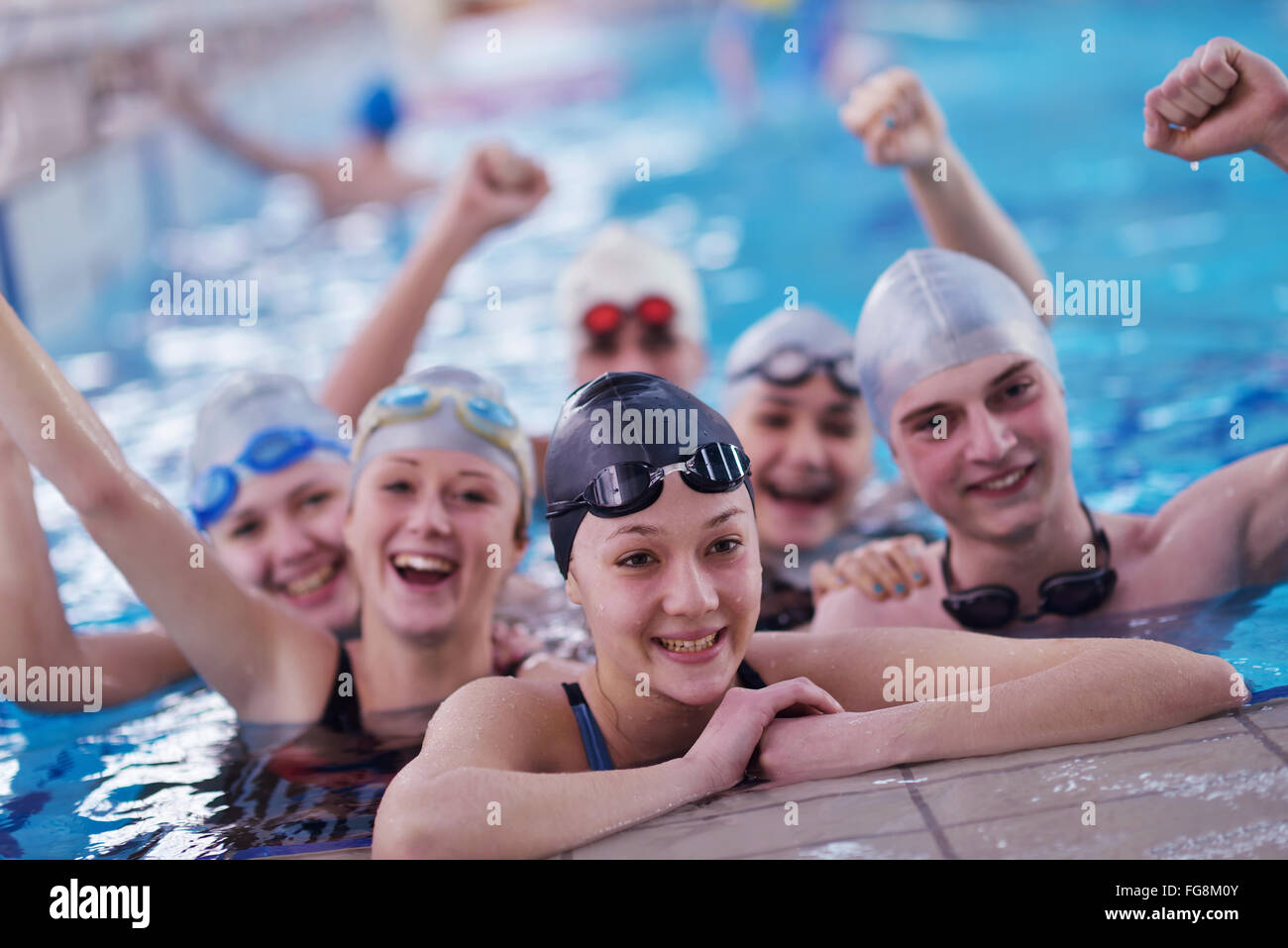 happy teen group at swimming pool Stock Photo - Alamy