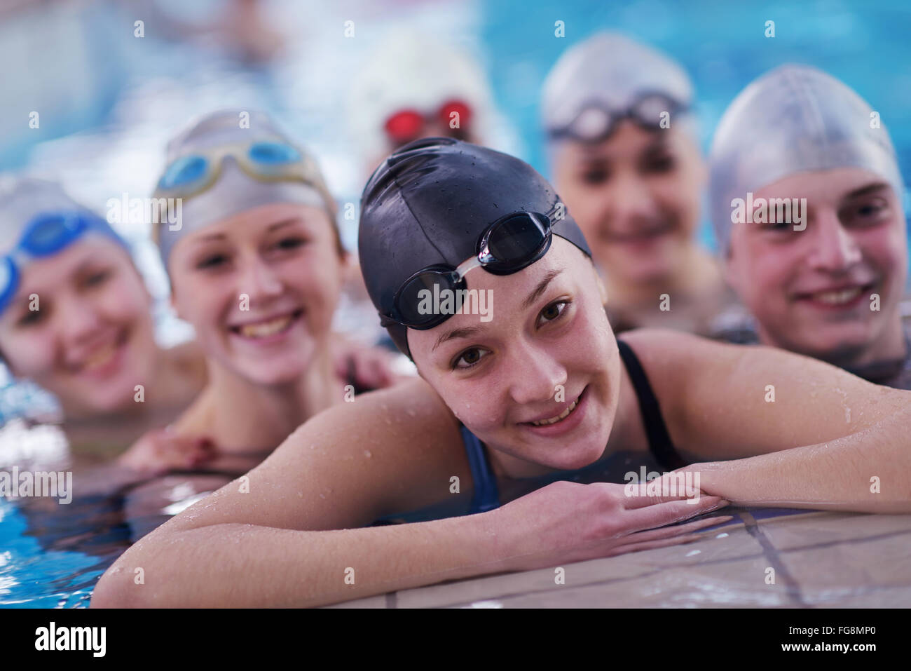 happy teen group at swimming pool Stock Photo - Alamy