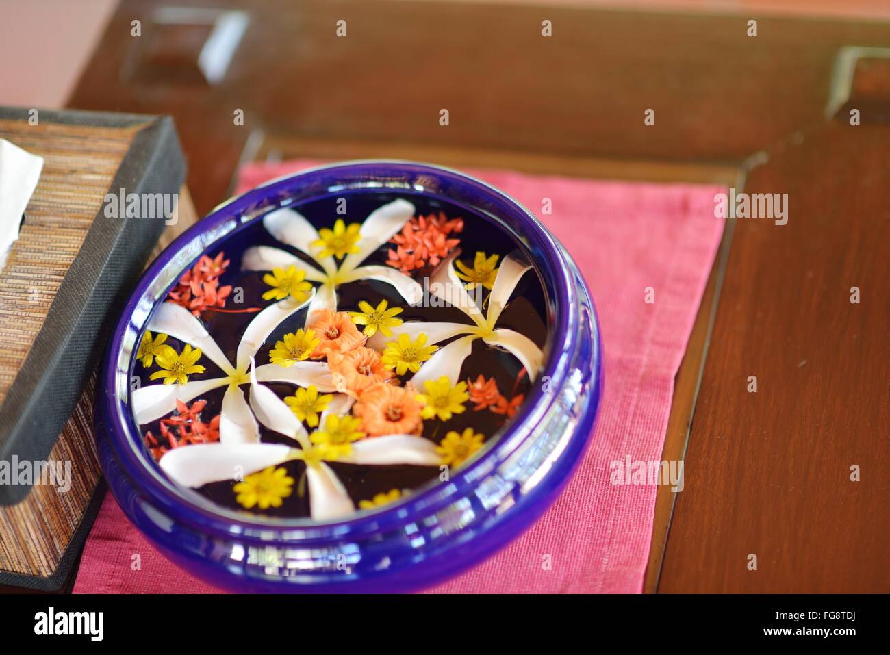 water cup with beautiful flowers background Stock Photo - Alamy