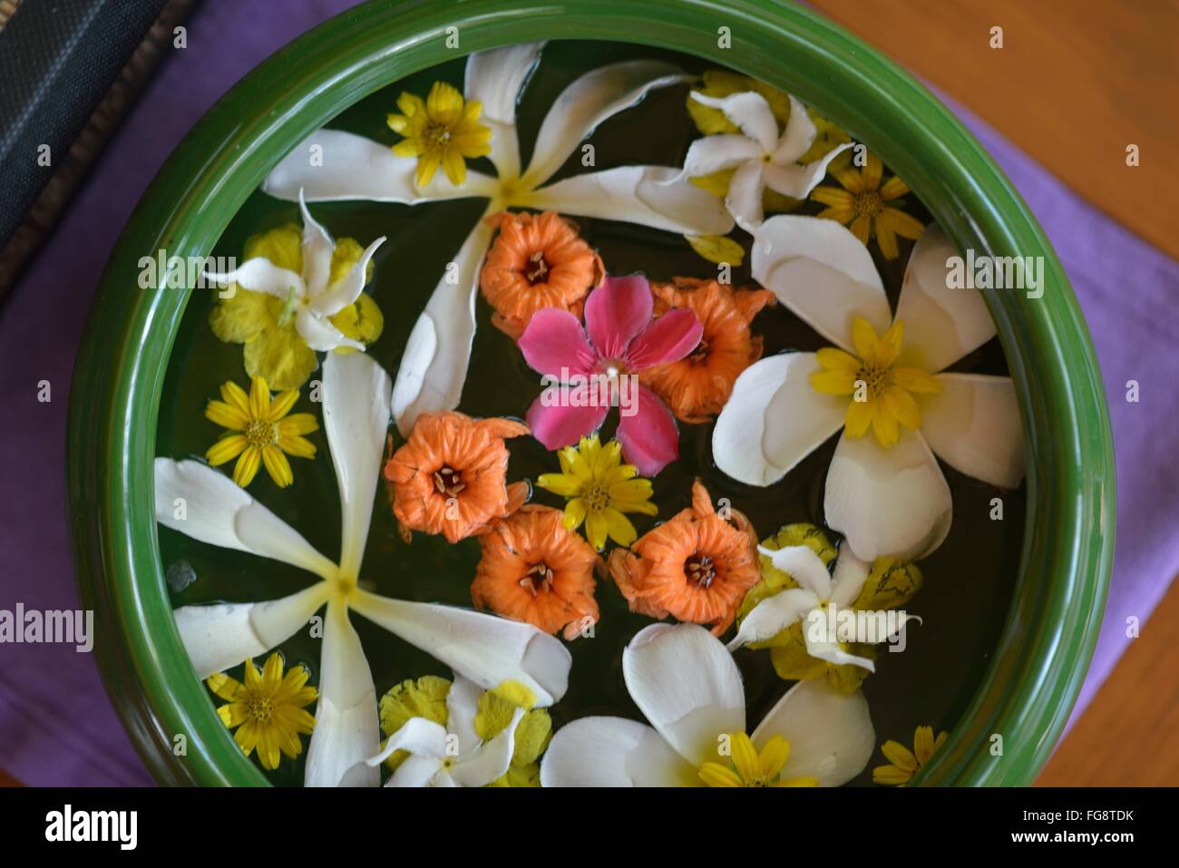 water cup with beautiful flowers background Stock Photo - Alamy
