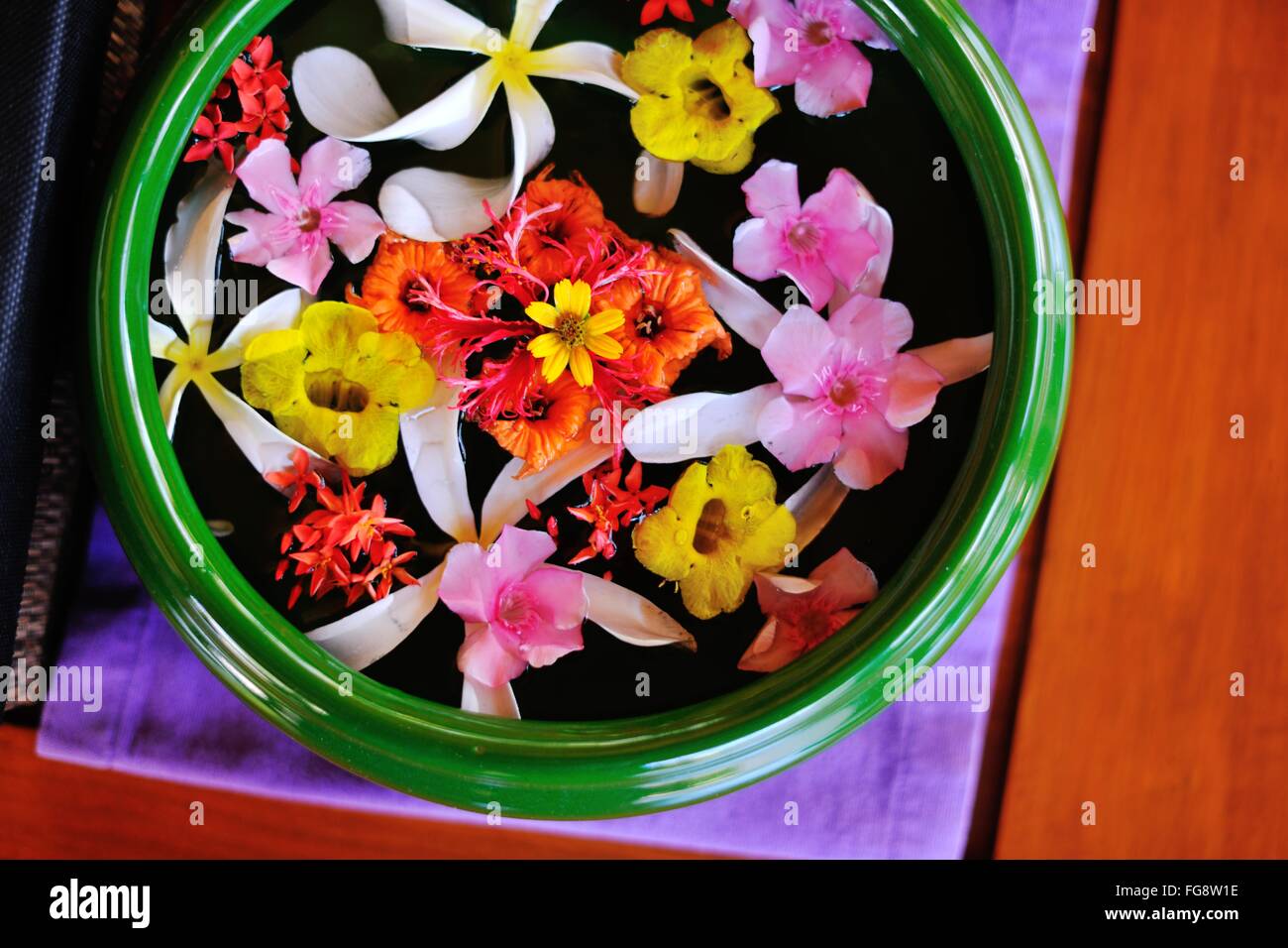 water cup with beautiful flowers background Stock Photo - Alamy