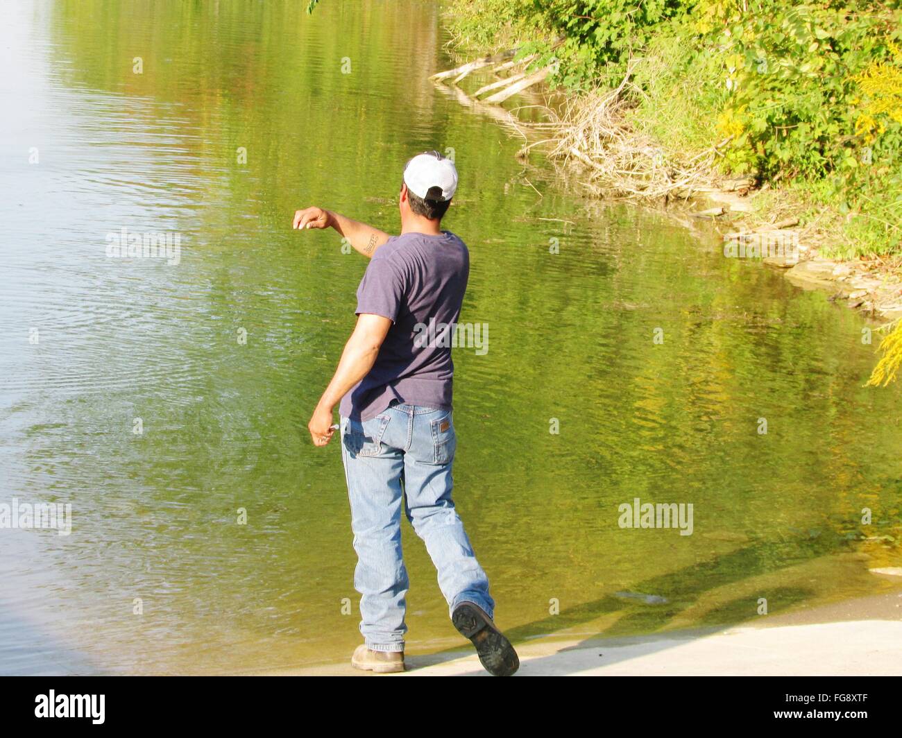 Throwing stone water hi-res stock photography and images - Alamy