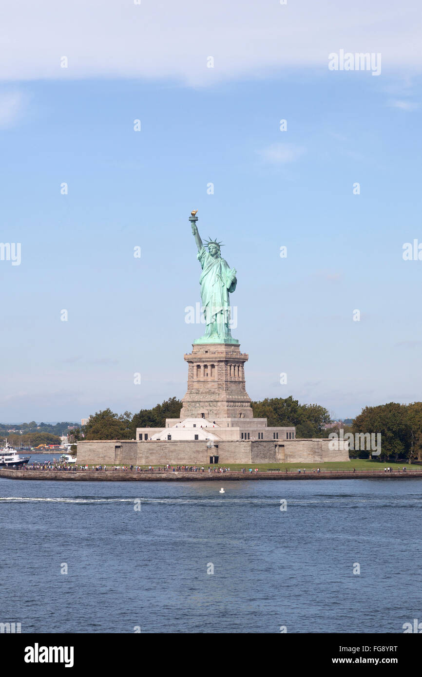 statue of miss liberty in new york city on sunny day with blue sky ...