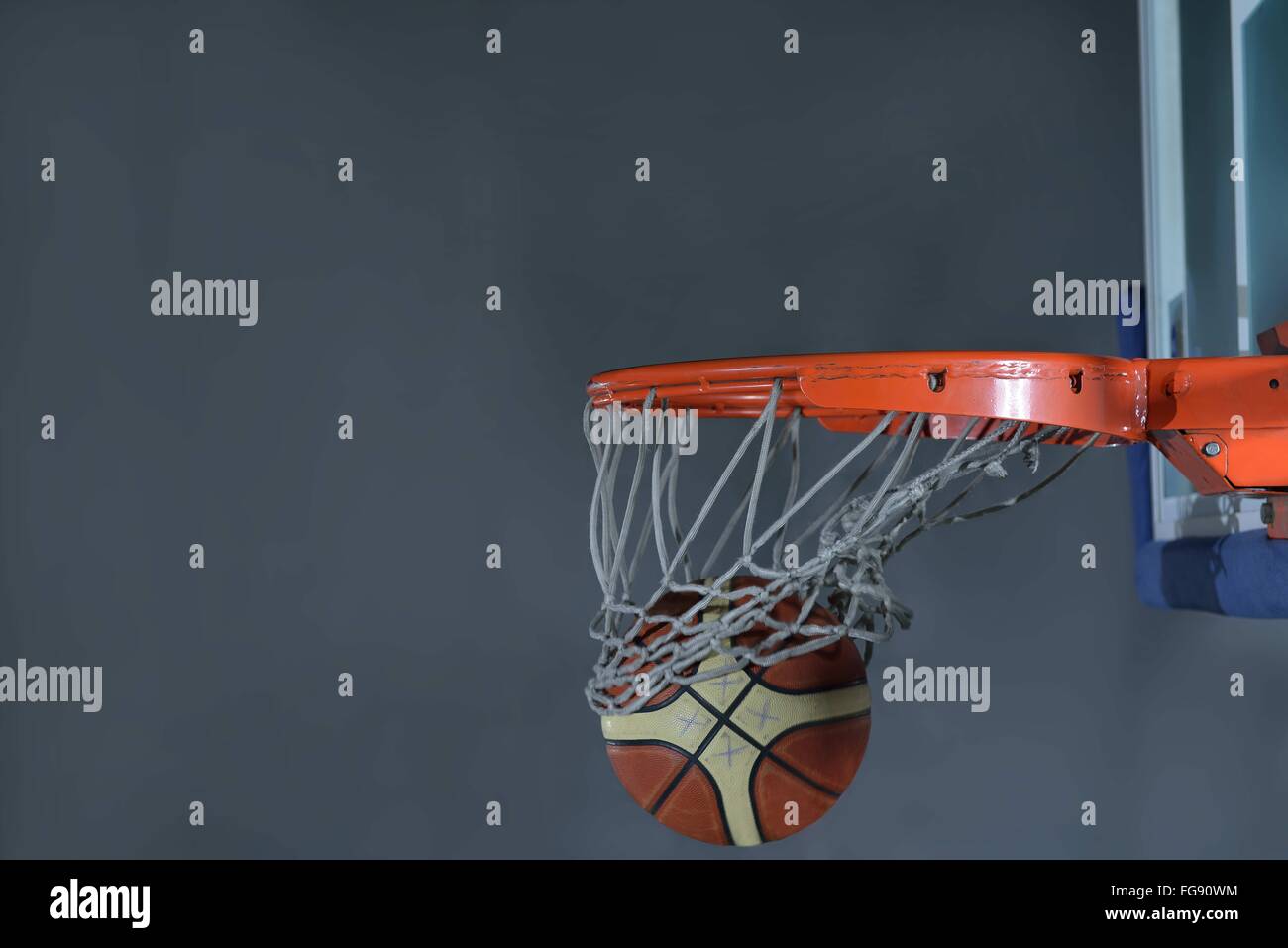 basketball ball and net on grey background Stock Photo - Alamy
