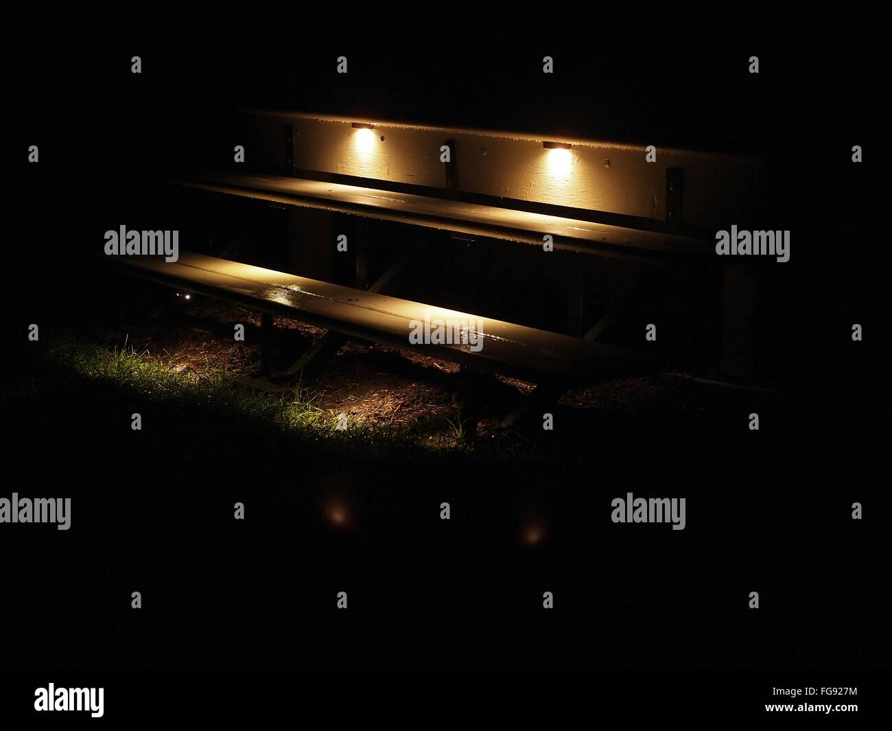 Illuminated Bench At Night Stock Photo - Alamy