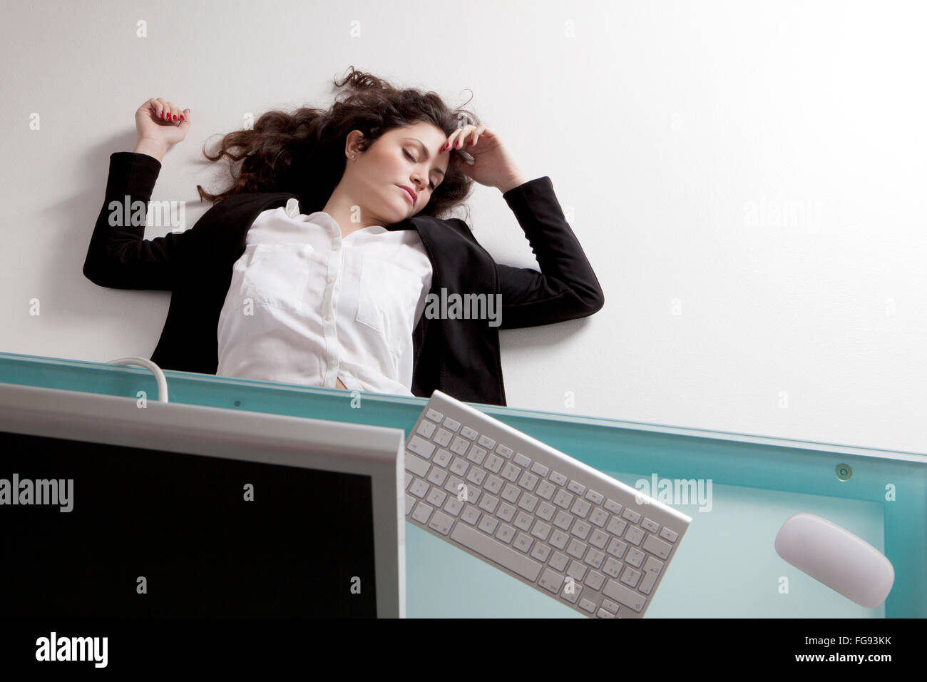 woman lying on the floor in the office Stock Photo - Alamy