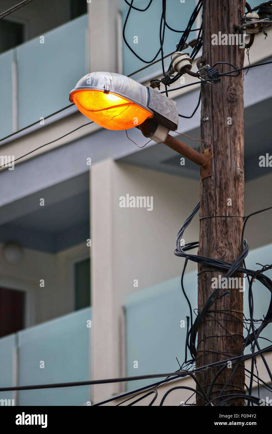 Closeup of illuminated street bulb and many electrical cables Stock ...