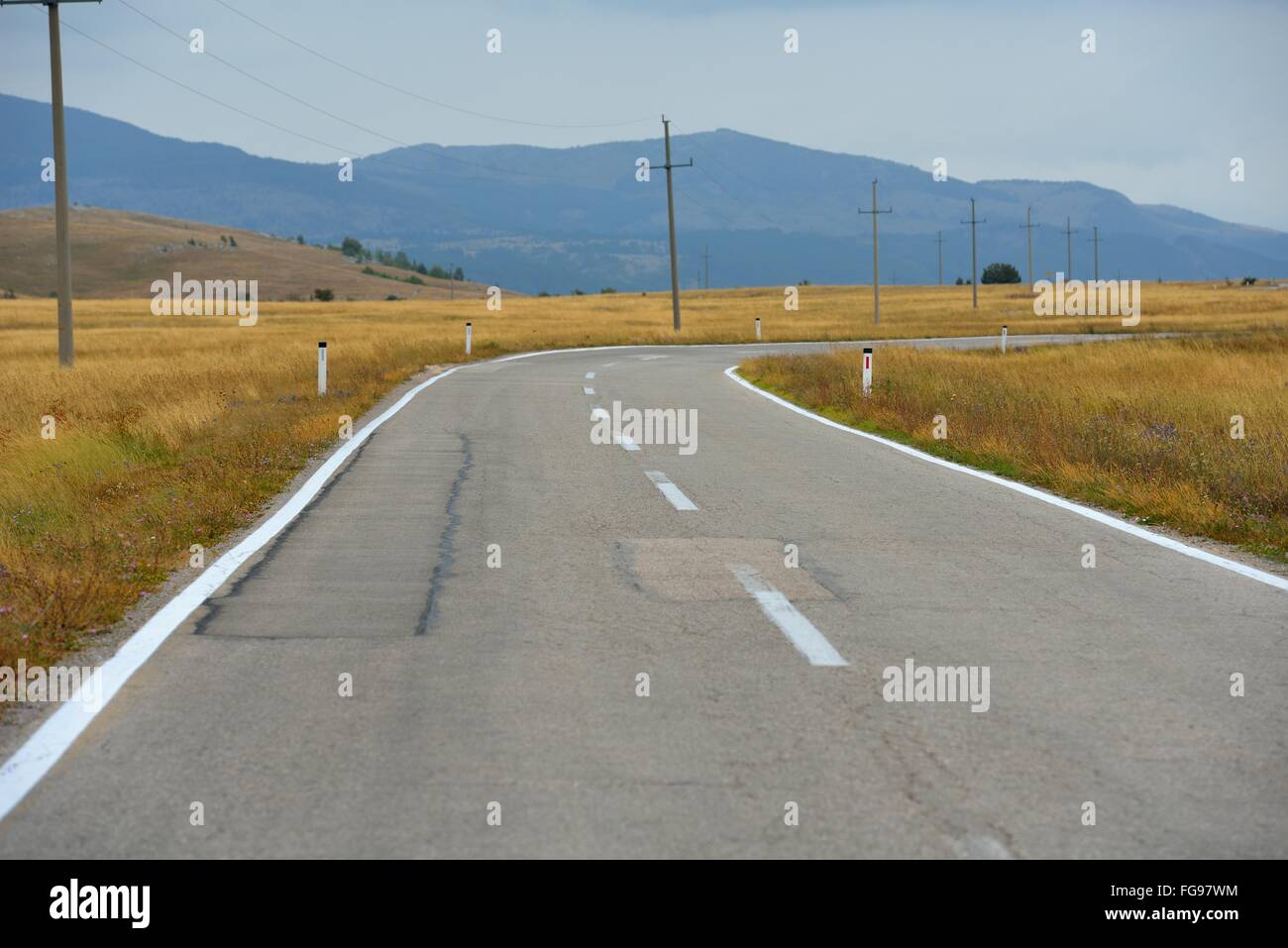 road through the green field Stock Photo - Alamy