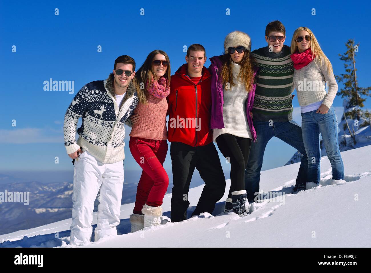friends have fun at winter on fresh snow Stock Photo - Alamy