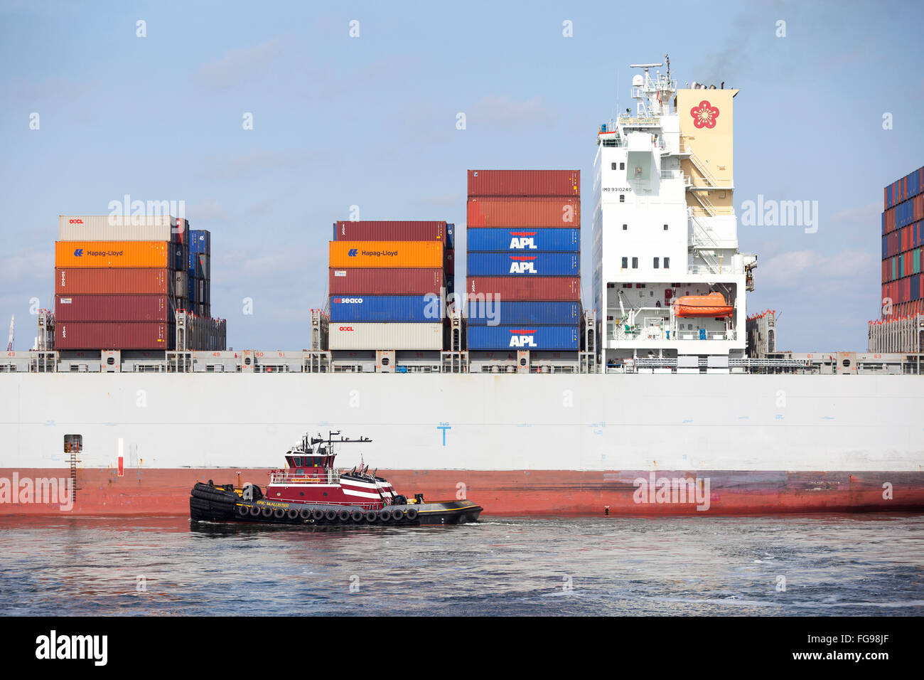 ship with colorful containers in harbor near new york with blue sky on ...