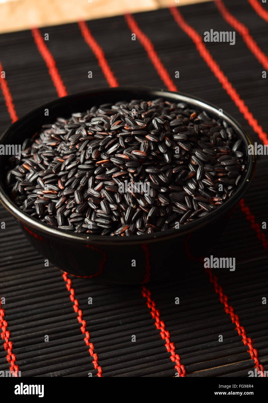 Uncooked, organic Black Rice, also known as Forbidden Rice Stock Photo ...