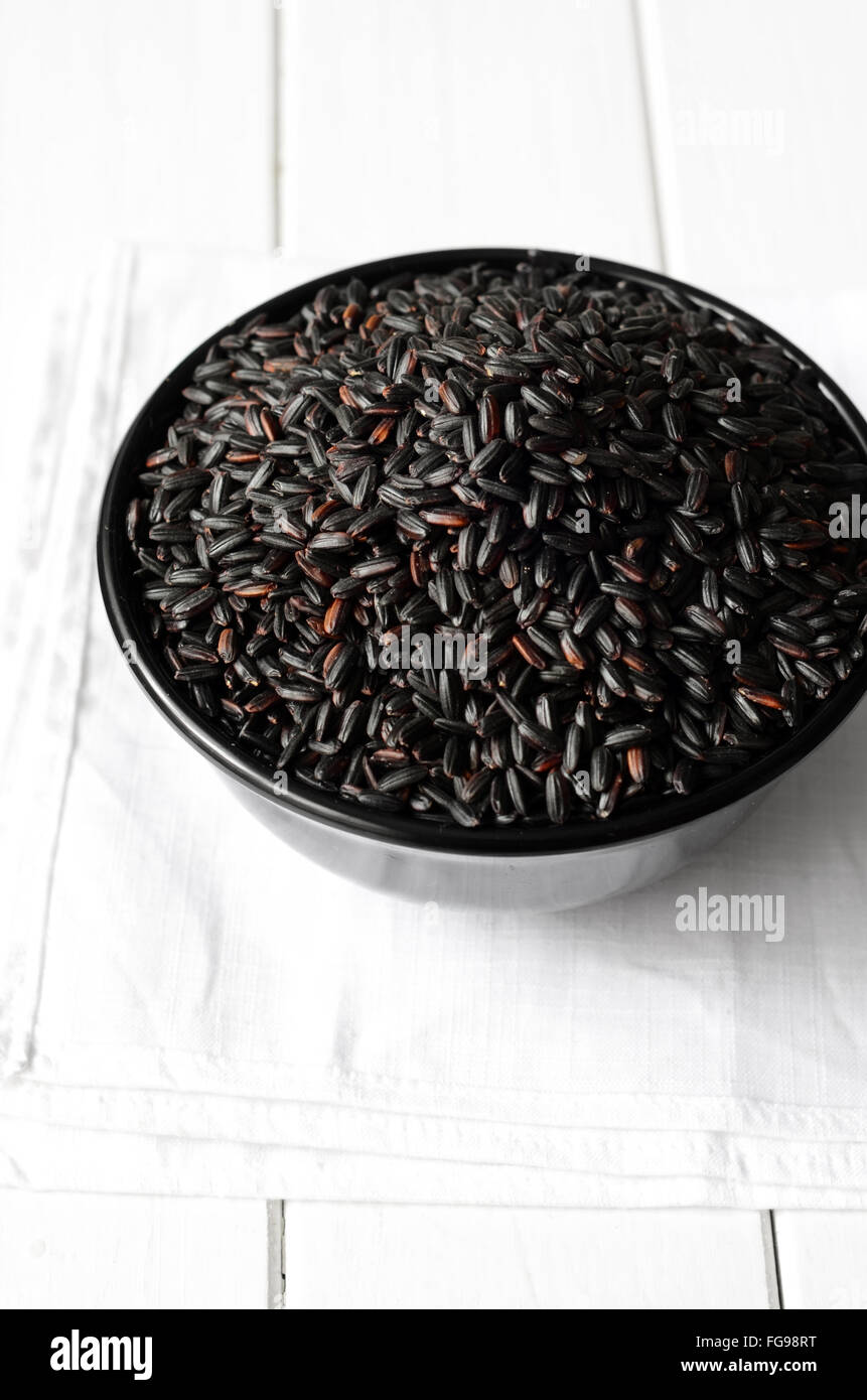 Uncooked, organic Black Rice, also known as Forbidden Rice Stock Photo ...