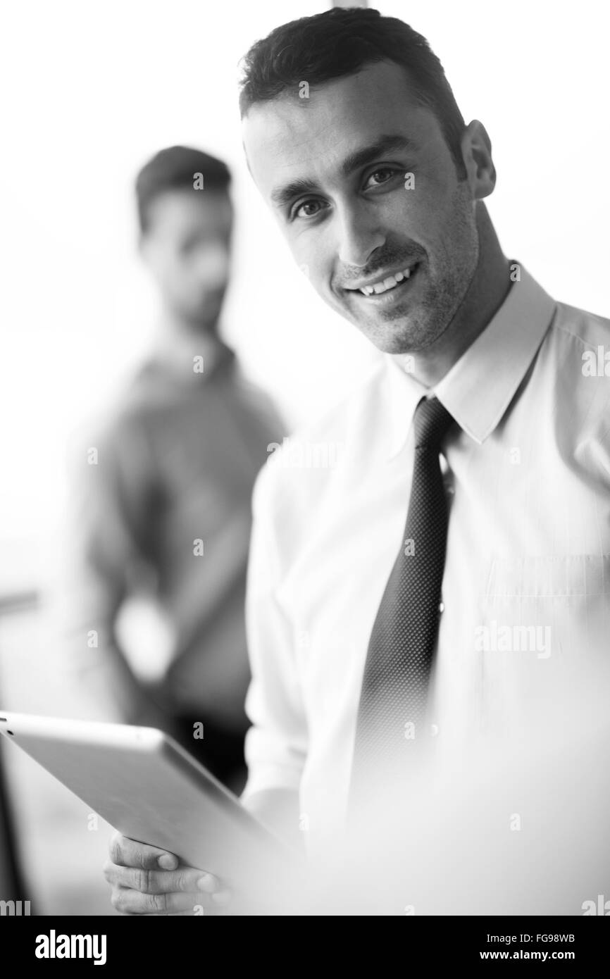 Businessman using tablet computer office Black and White Stock Photos ...