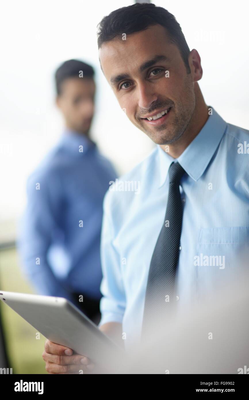 business man using tablet compuer at office Stock Photo - Alamy