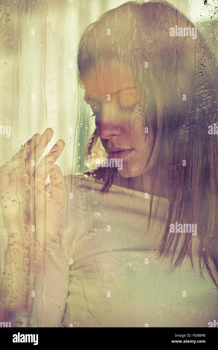 Woman behind window drops hi-res stock photography and images - Alamy