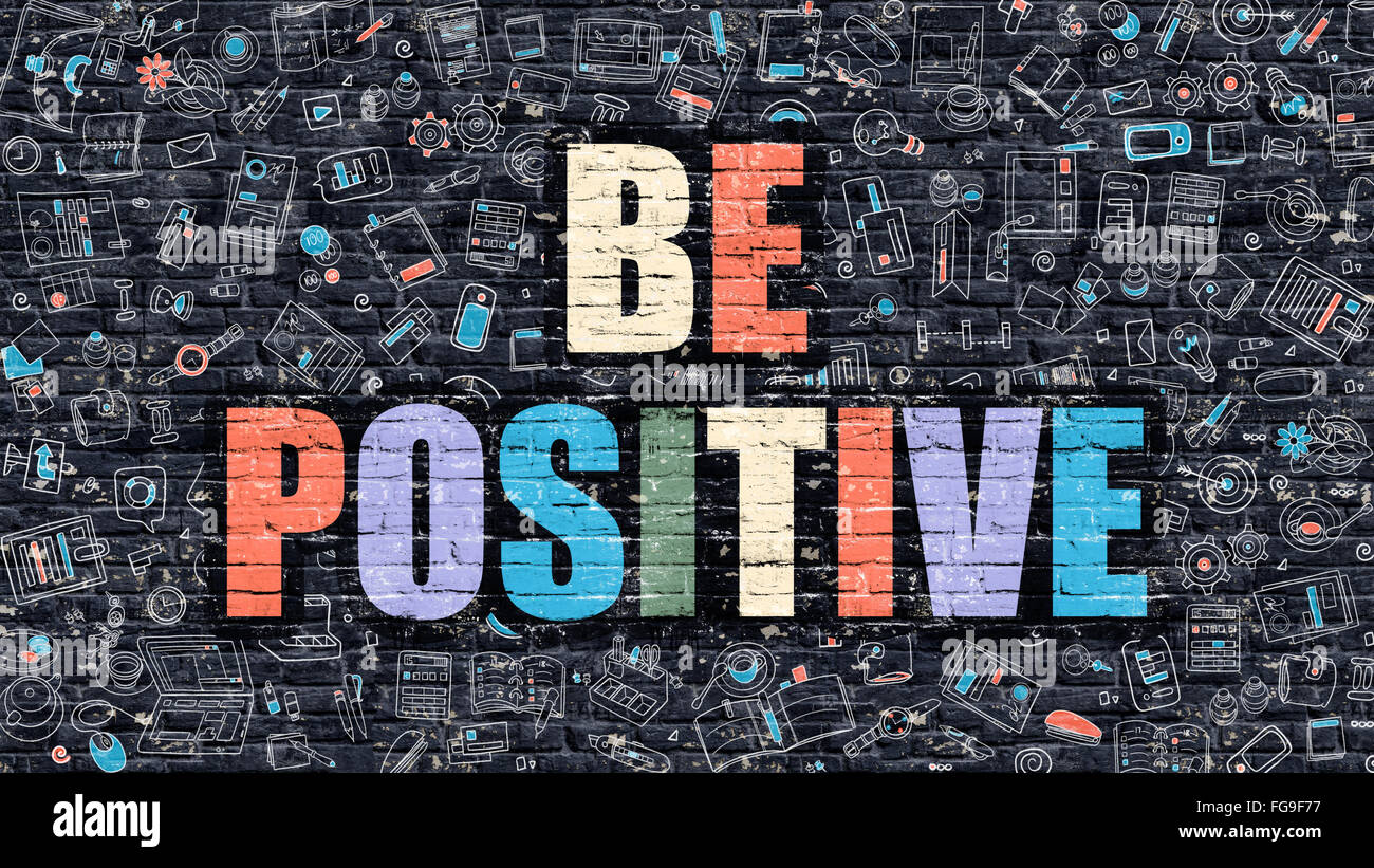 Multicolor Be Positive on Dark Brickwall. Doodle Style Stock Photo - Alamy