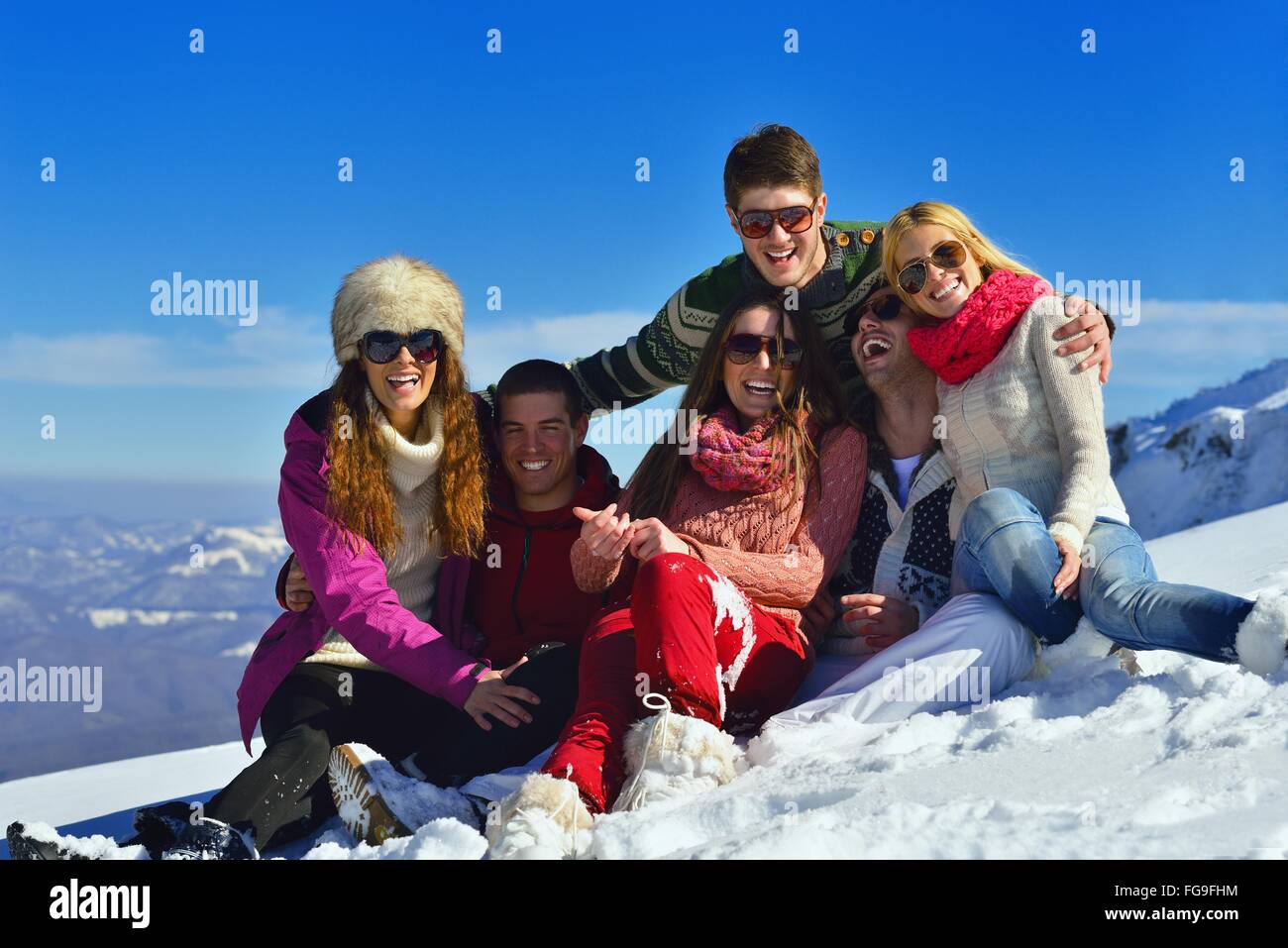 friends have fun at winter on fresh snow Stock Photo - Alamy