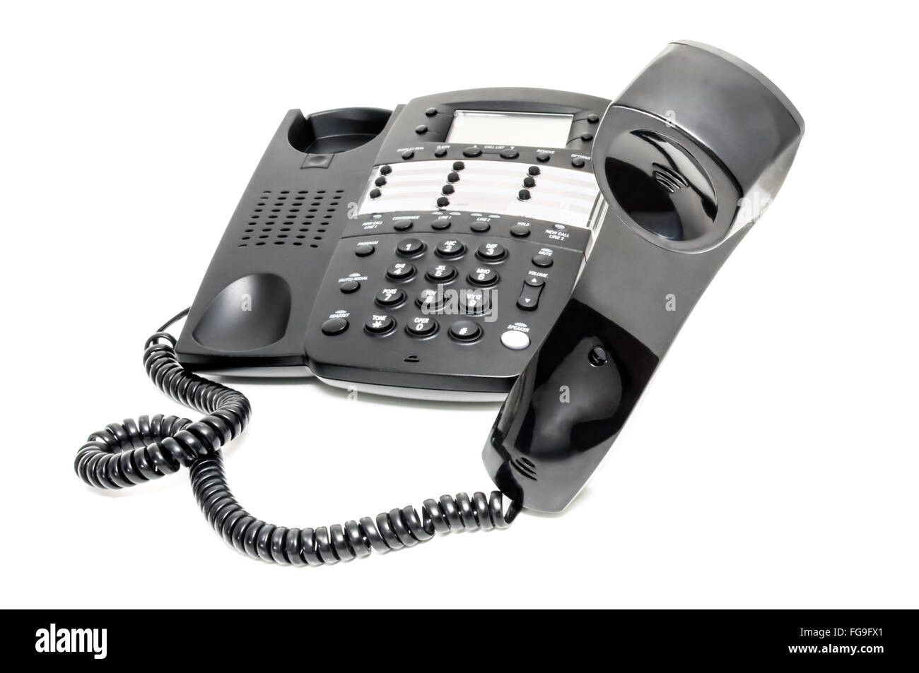 Black business landline telephone with its receiver off of the hook on ...