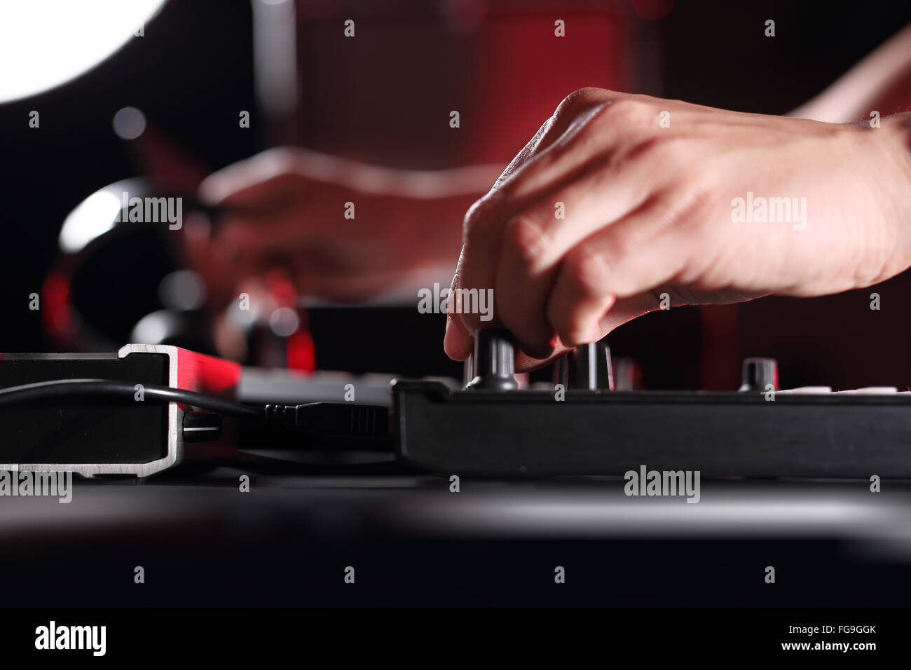 Hands DJ mixing music at the club during the event. DJ, dance and ...