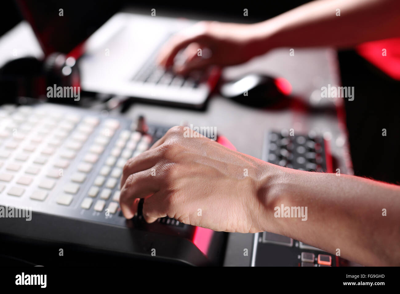 Hands DJ mixing music at the club during the event. DJ, dance and ...