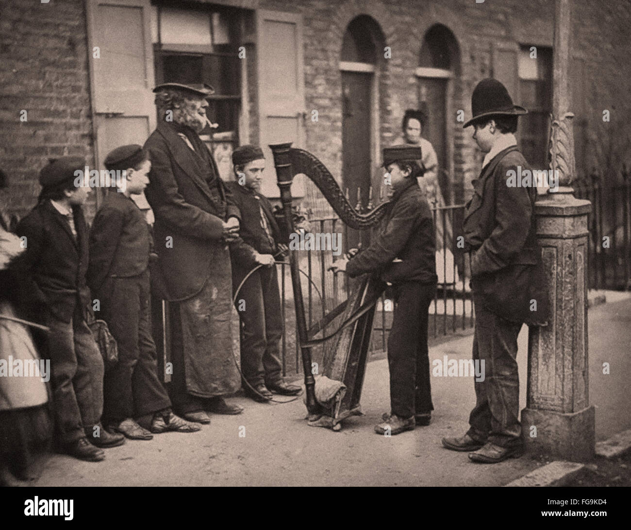 Street Life in London from the Victorian Era - Street Musician with ...