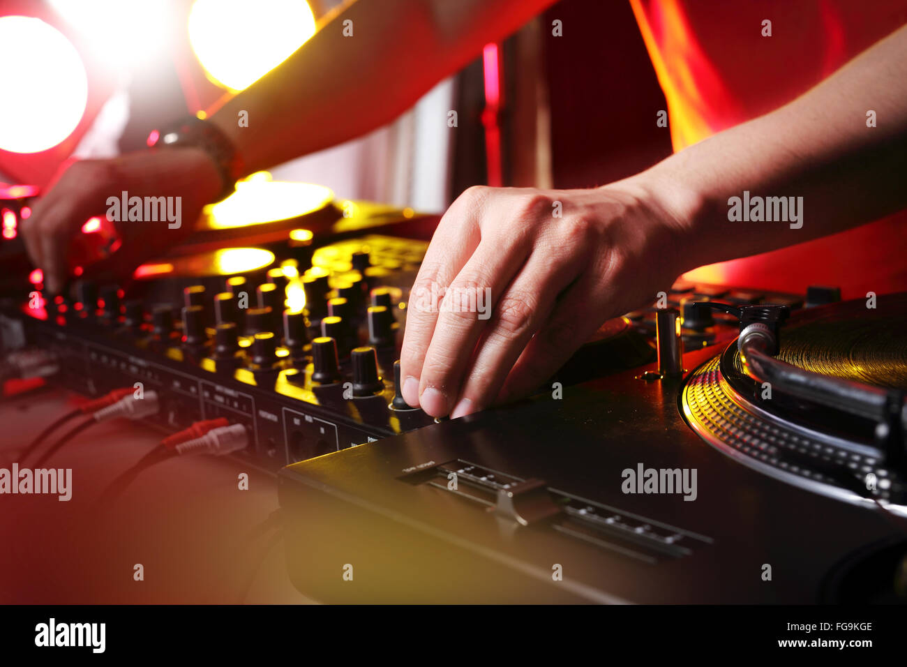 DJ. mixing music. Working in the club. Mixing console, DJ job in the ...