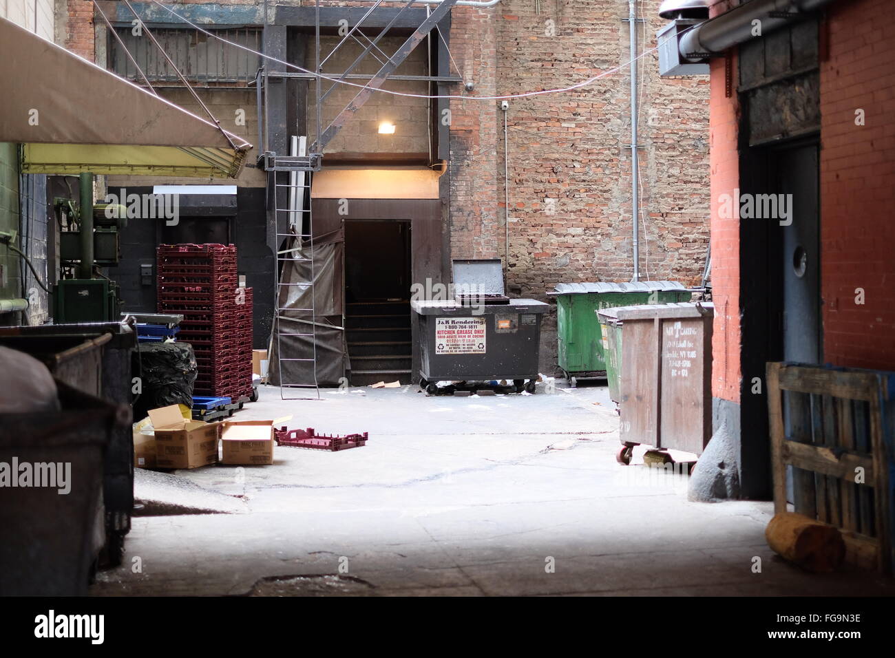 Garbage Bins On Street Against Building Stock Photo - Alamy