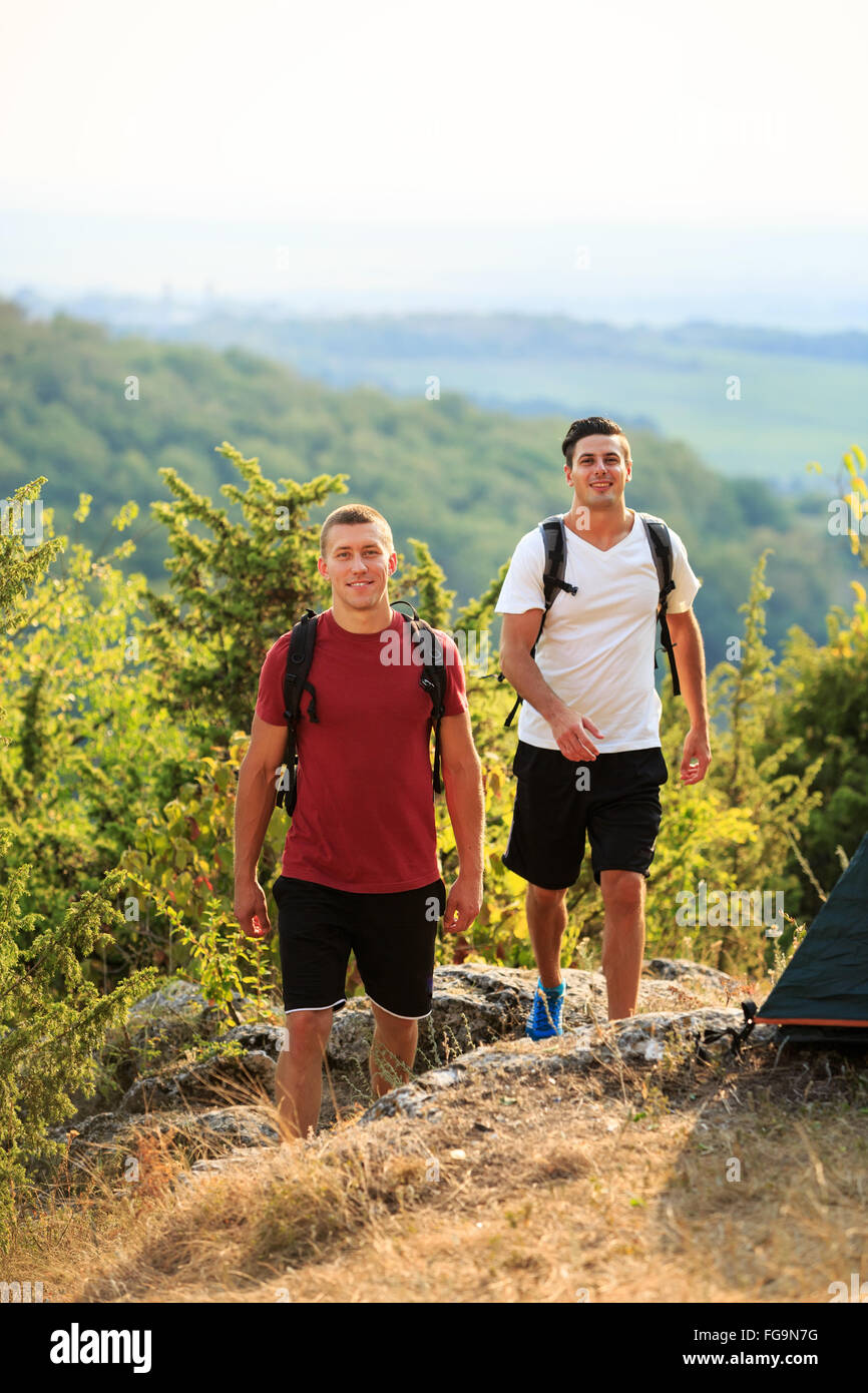 Two backpackers in the summer mountain Stock Photo - Alamy