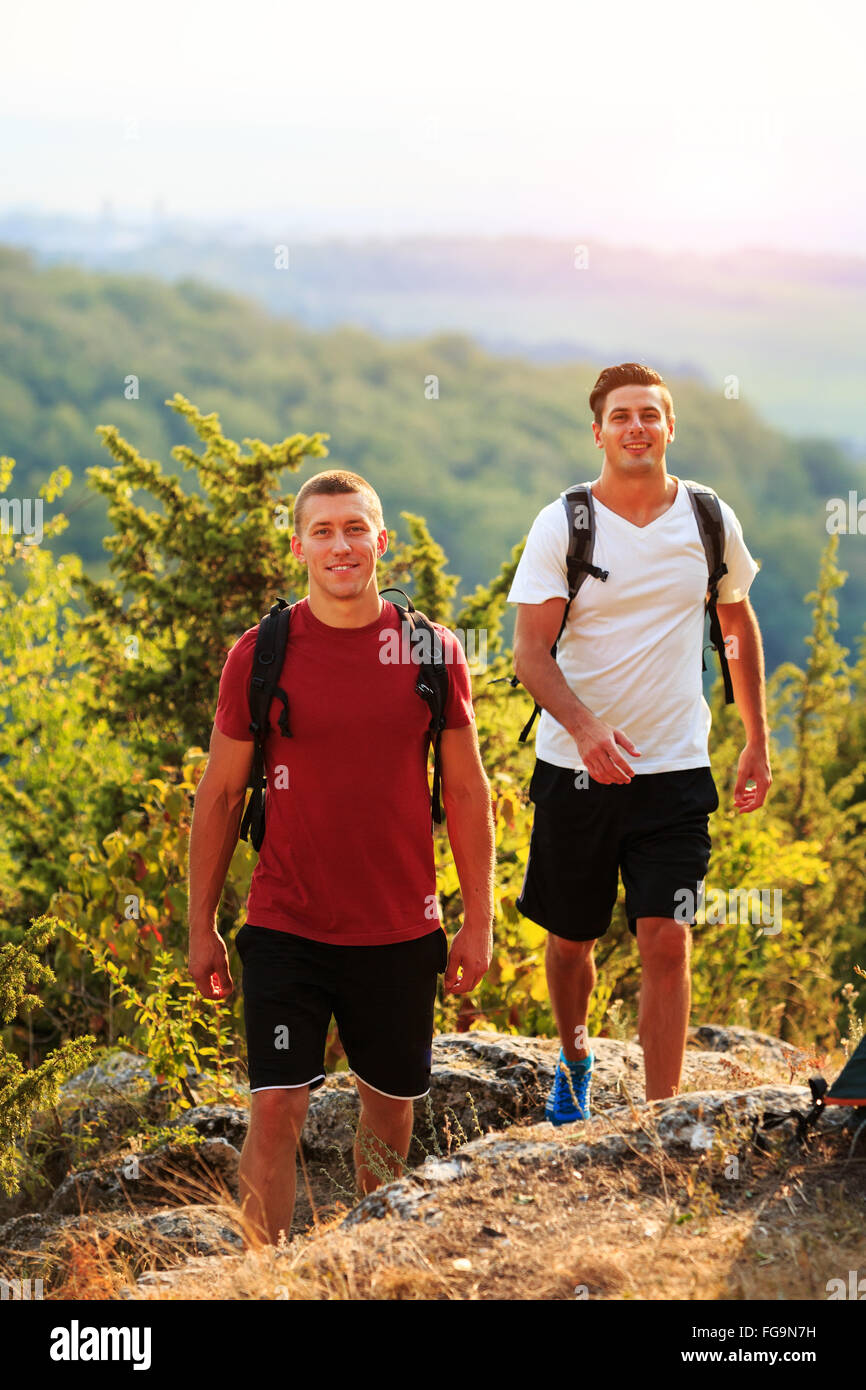 Two backpackers in the summer mountain Stock Photo - Alamy