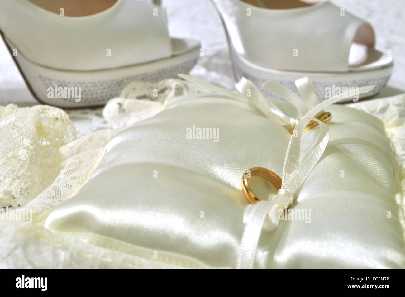 Details of wedding ring and shoes Stock Photo - Alamy
