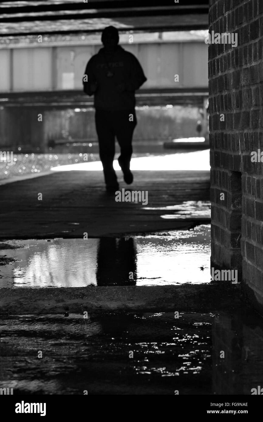 jogging run running river puddle reflection Stock Photo - Alamy