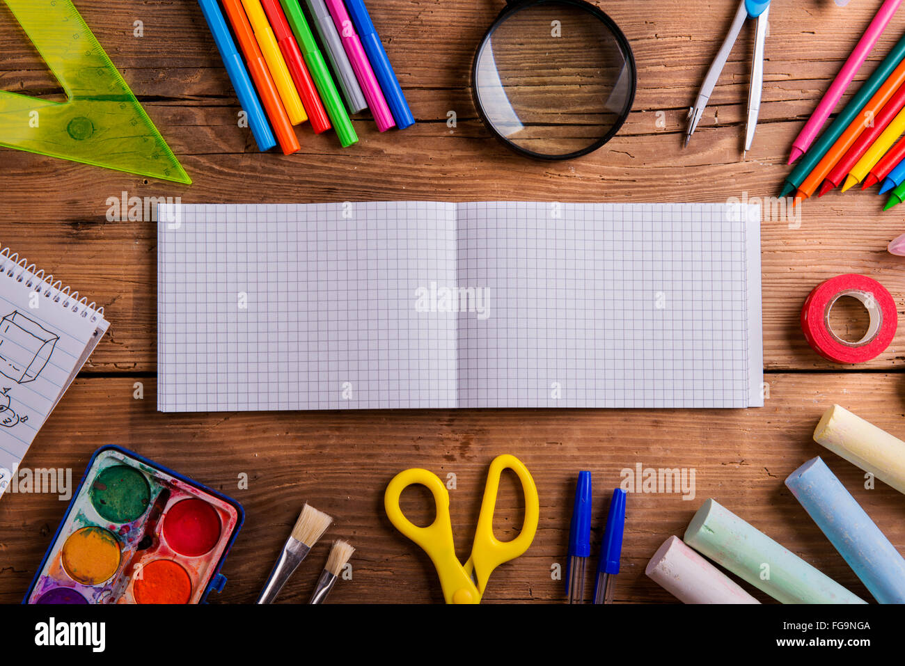 Desk, school supplies, squared paper, wooden background, copy sp Stock ...
