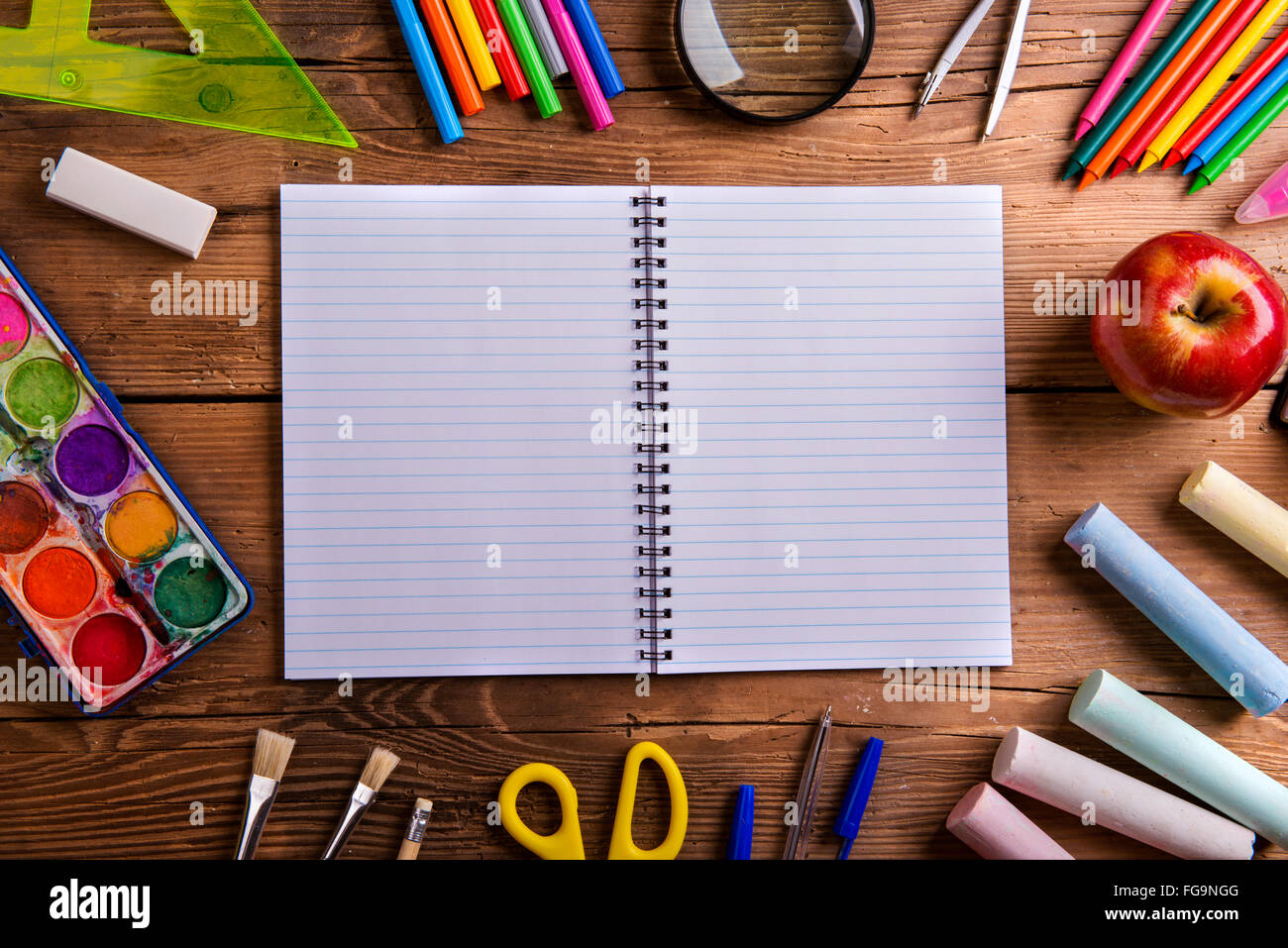 Desk, school supplies, lined paper, wooden background, copy spac Stock ...